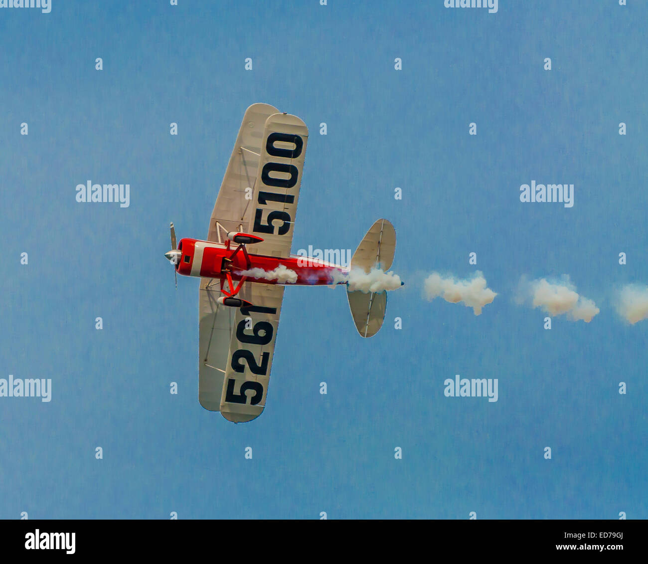 bi plane in sky with emission skywriter Stock Photo - Alamy
