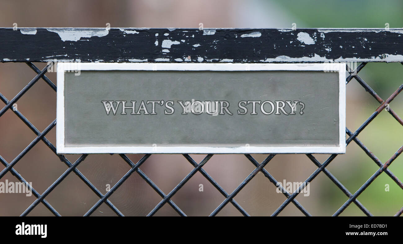 Sign hanging on an old metallic gate - Whats your story Stock Photo - Alamy