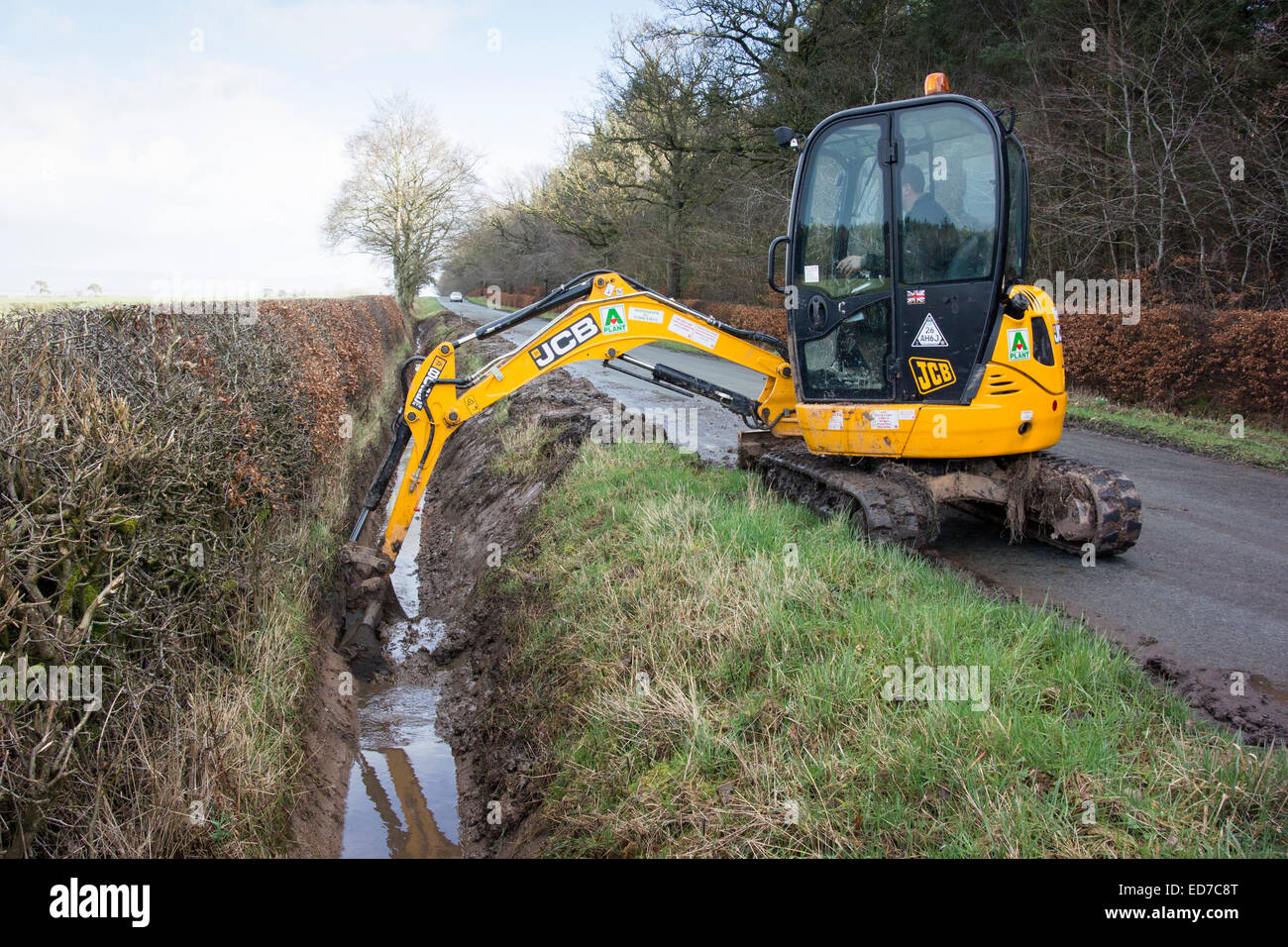 Road Ditch Maintenance On The Side Of The Road There Is A Concrete
