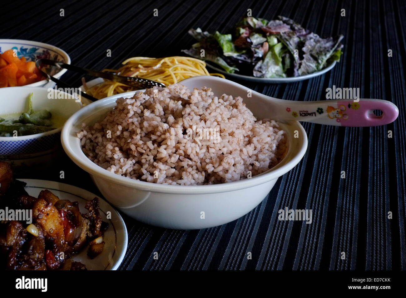 Traditional Cracked Red Rice served in a restaurant in Bhutan Stock ...