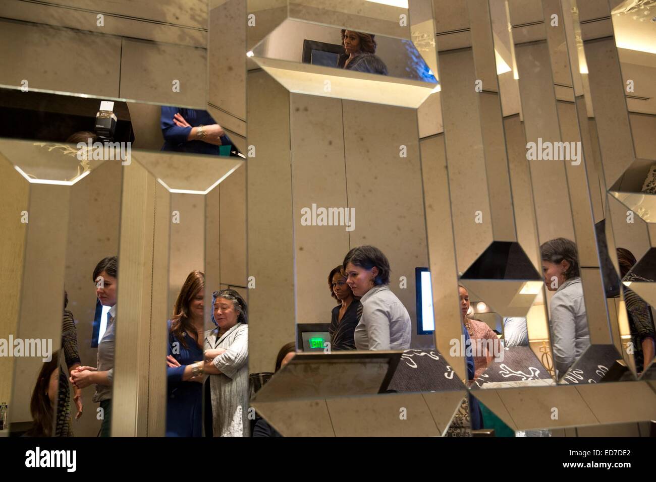 US First Lady Michelle Obama is reflected in mirrors backstage at the ...