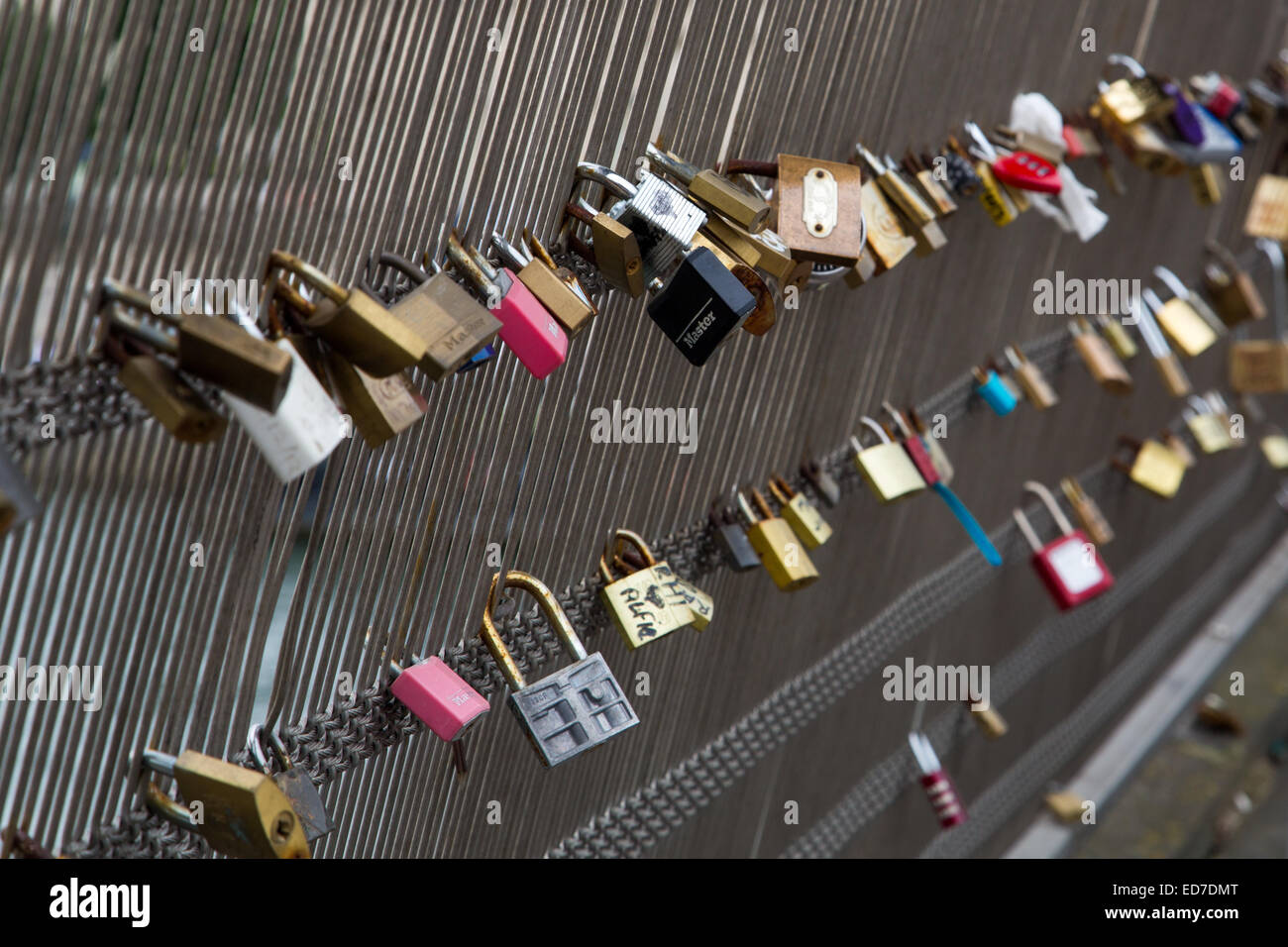 The locks at the fence of Pont des Arts in Paris Stock Photo - Alamy