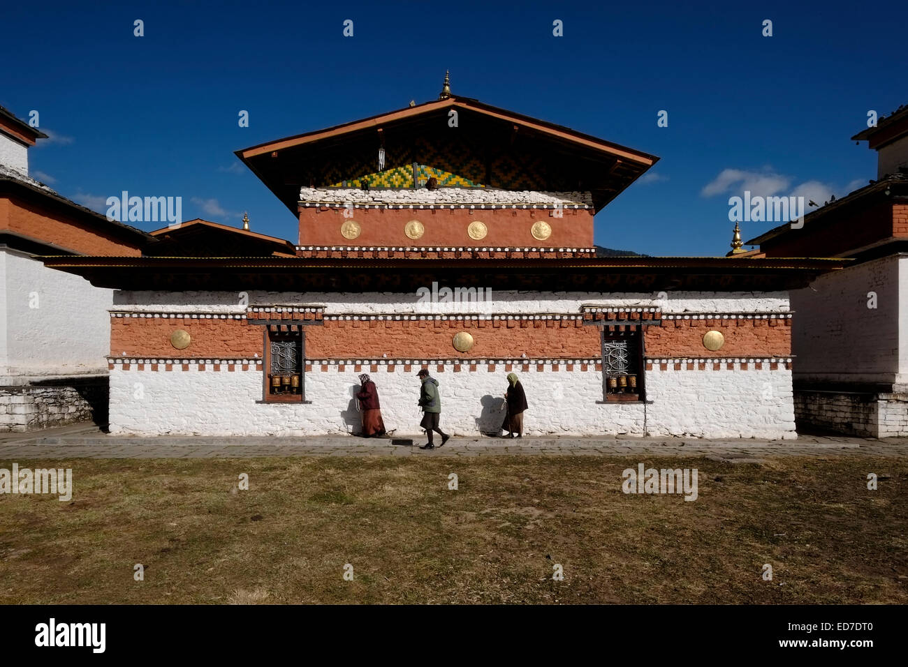 Buddhist devotees circumambulate the Buddhist Jambay Lhakhang or Temple ...