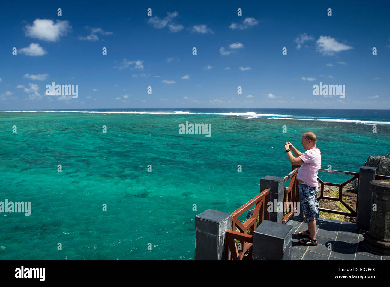 Mauritius, Baie du Cap, visitor taking photograph from Maconde ...