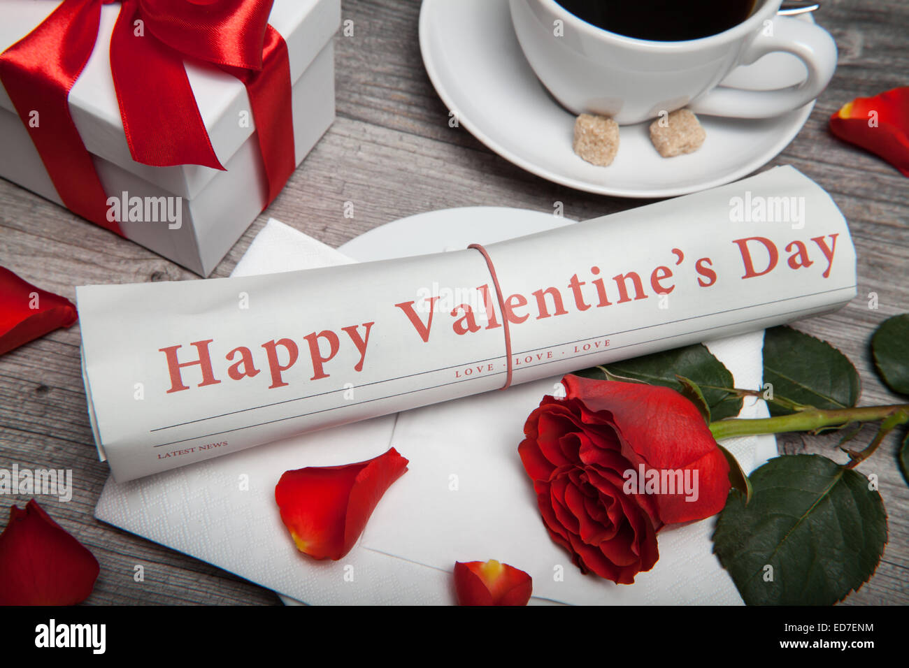 "happy valentine's day" on newspaper, cup of coffee and present Stock ...