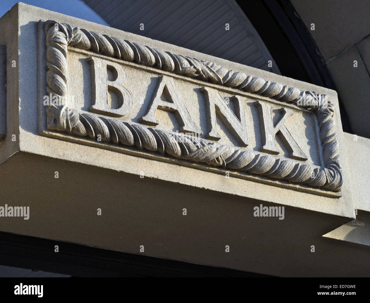 Bank sign in stone Stock Photo - Alamy