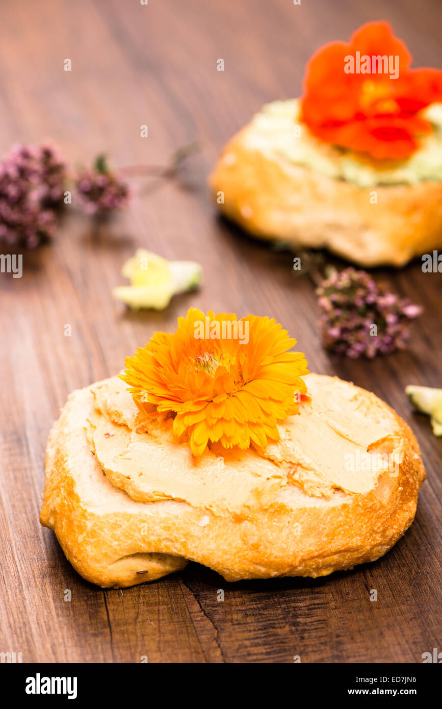 Rolls with farmer cheese and edible flowers Stock Photo - Alamy