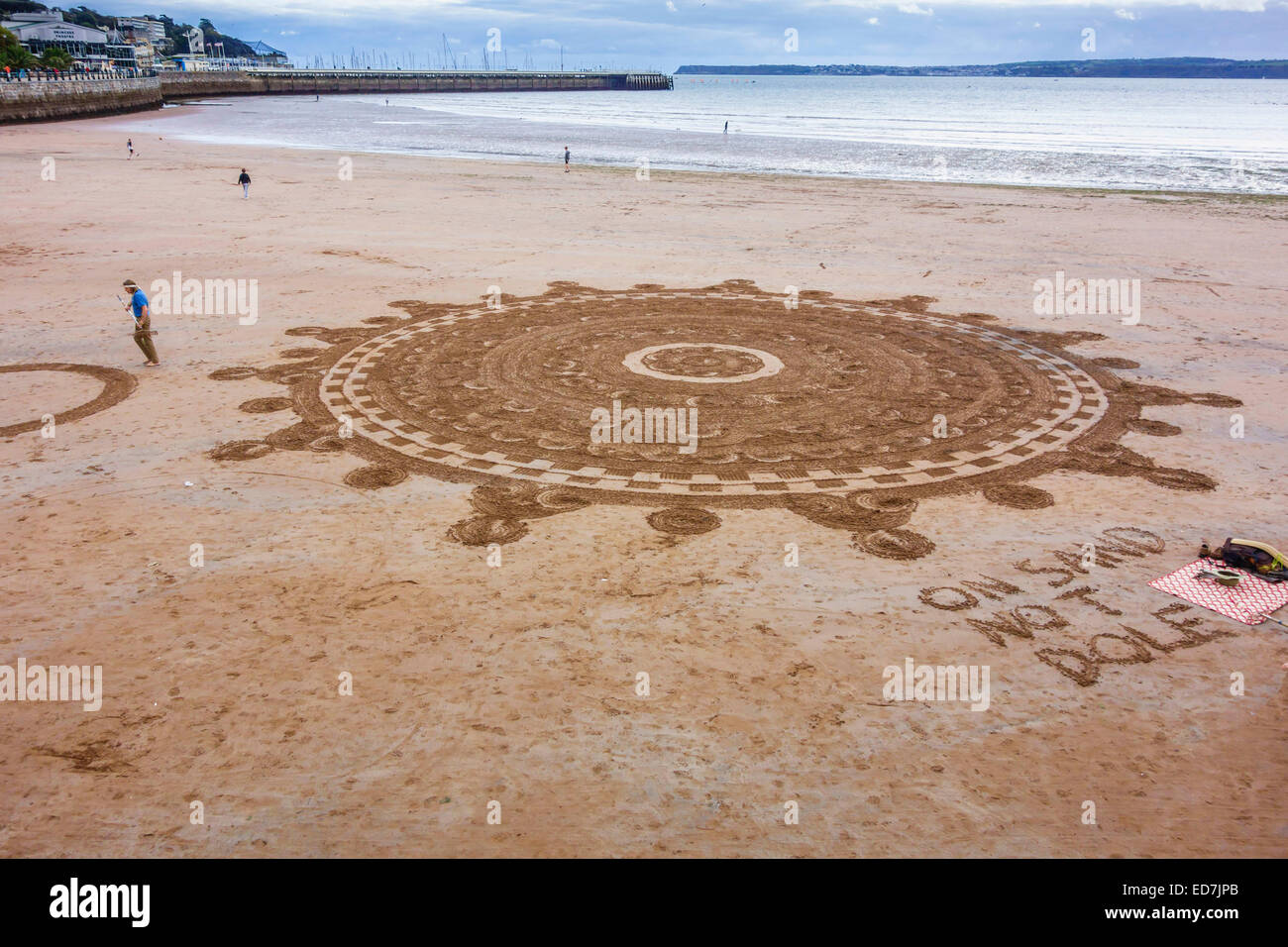 Sand artist showing his skills on Torquay beach Devon UK Stock Photo ...