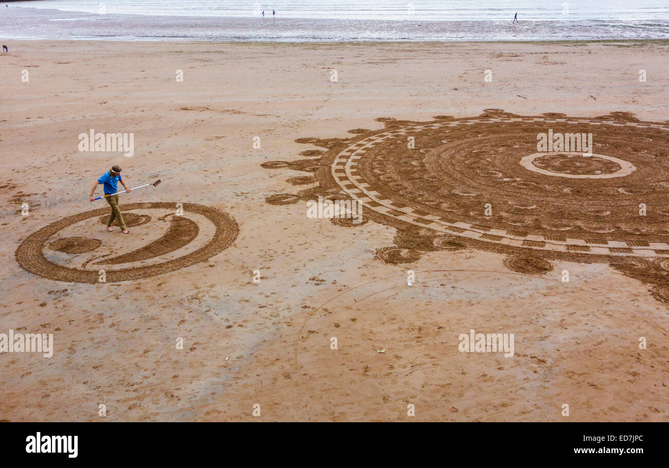 Sand artist showing his skills on Torquay beach Devon UK Stock Photo ...
