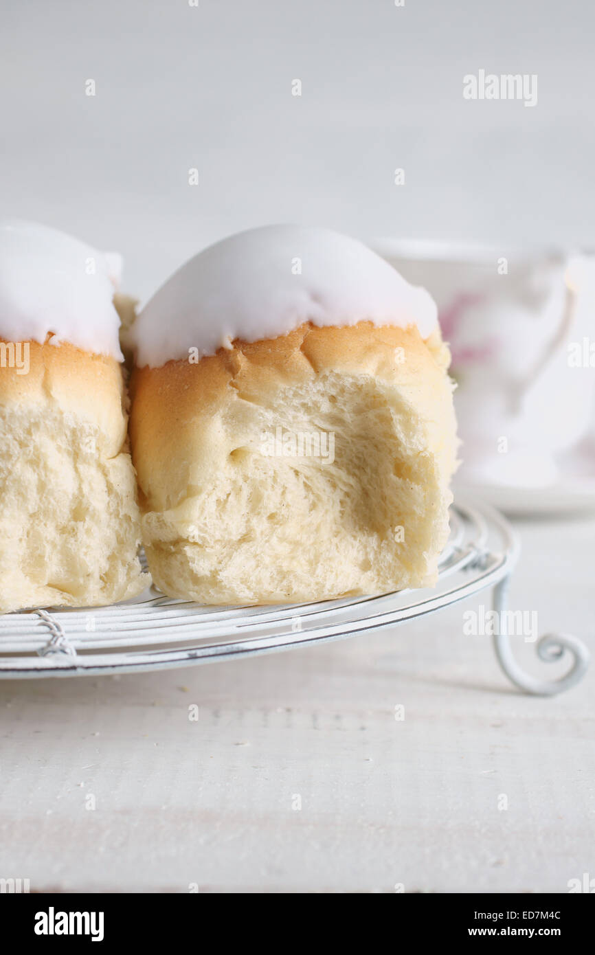 Iced buns or fingers a cake made from a bread roll covered with icing ...