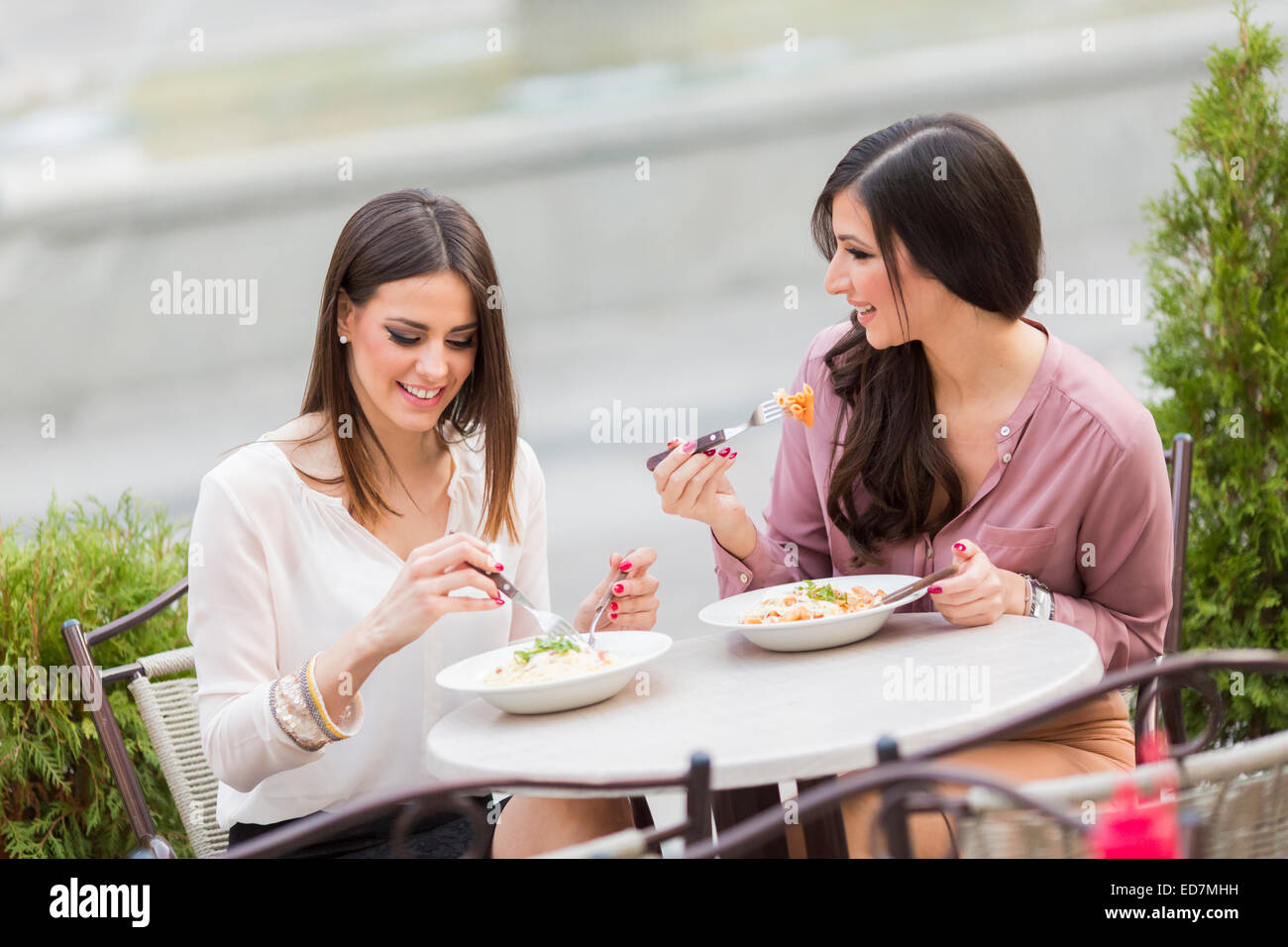 Young pretty woman eating snack hi-res stock photography and images - Alamy