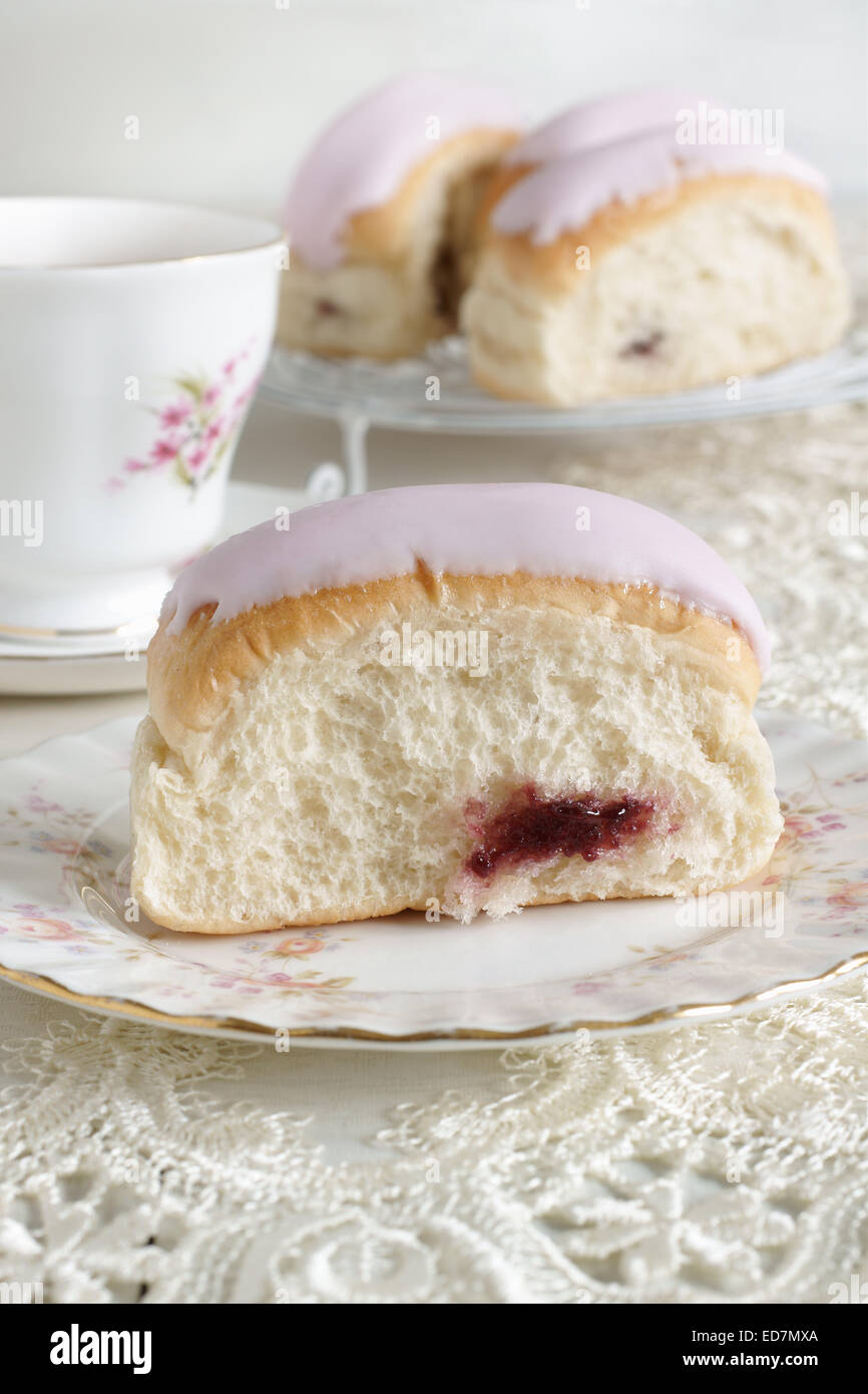 Iced buns or fingers a cake made from a bread roll covered with icing ...