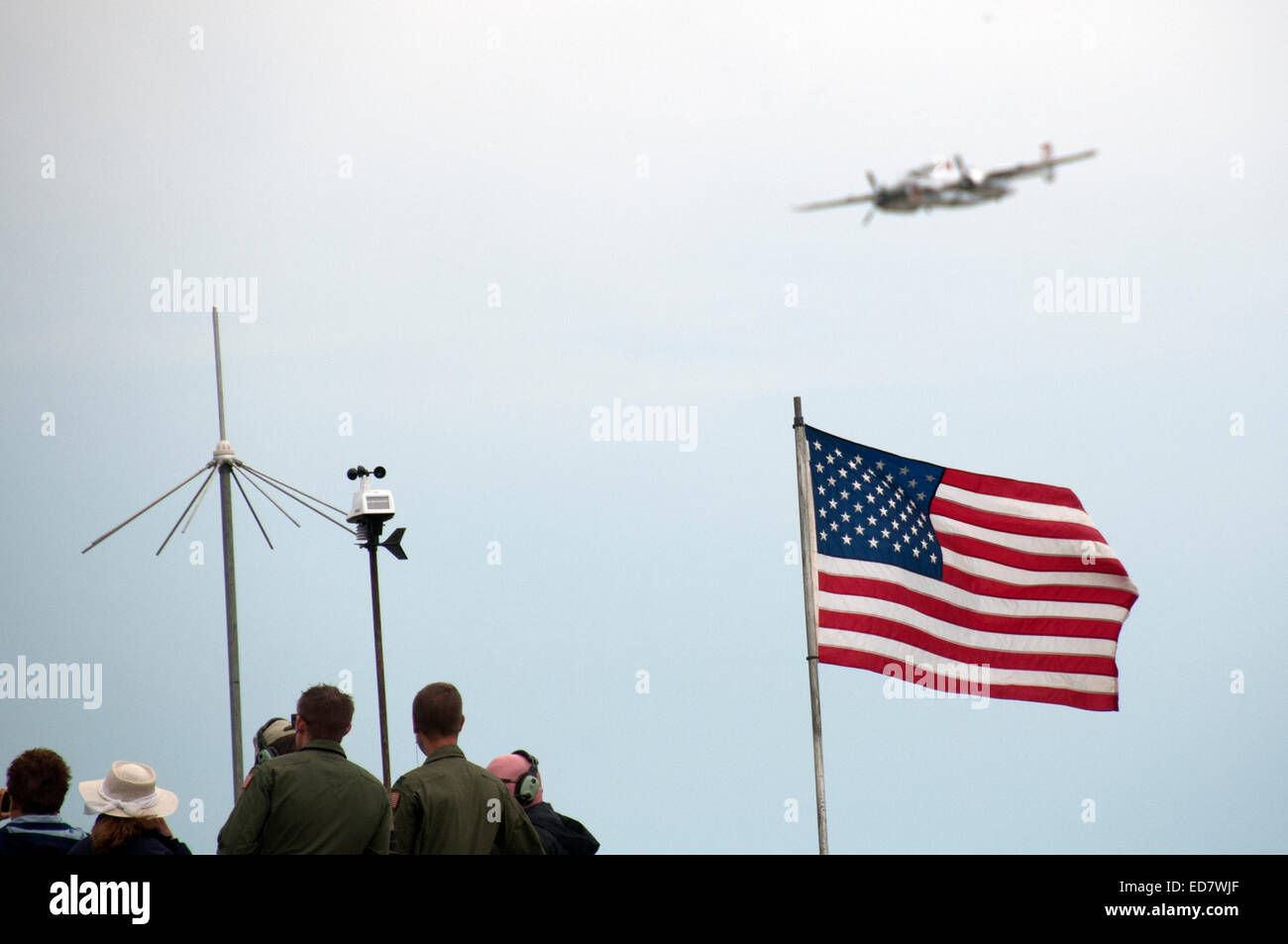 B25 bomber flies over USA flag Stock Photo - Alamy