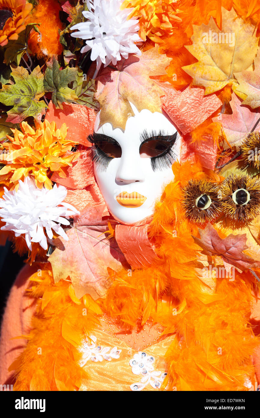 A orange mask inspired by autumn exhibited during the traditional ...