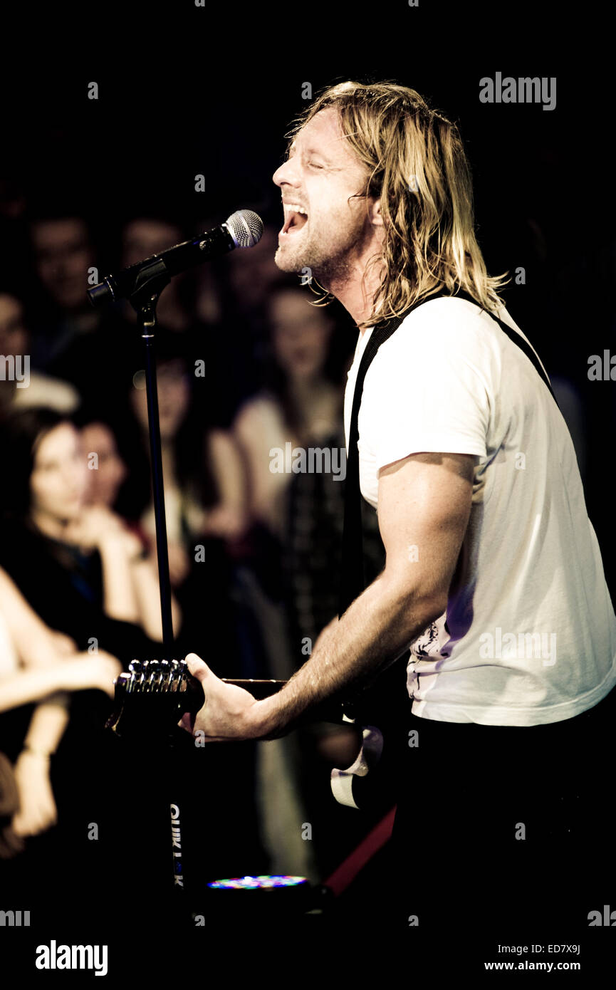 Jon Foreman of Switchfoot playing live with crowd in background Stock ...