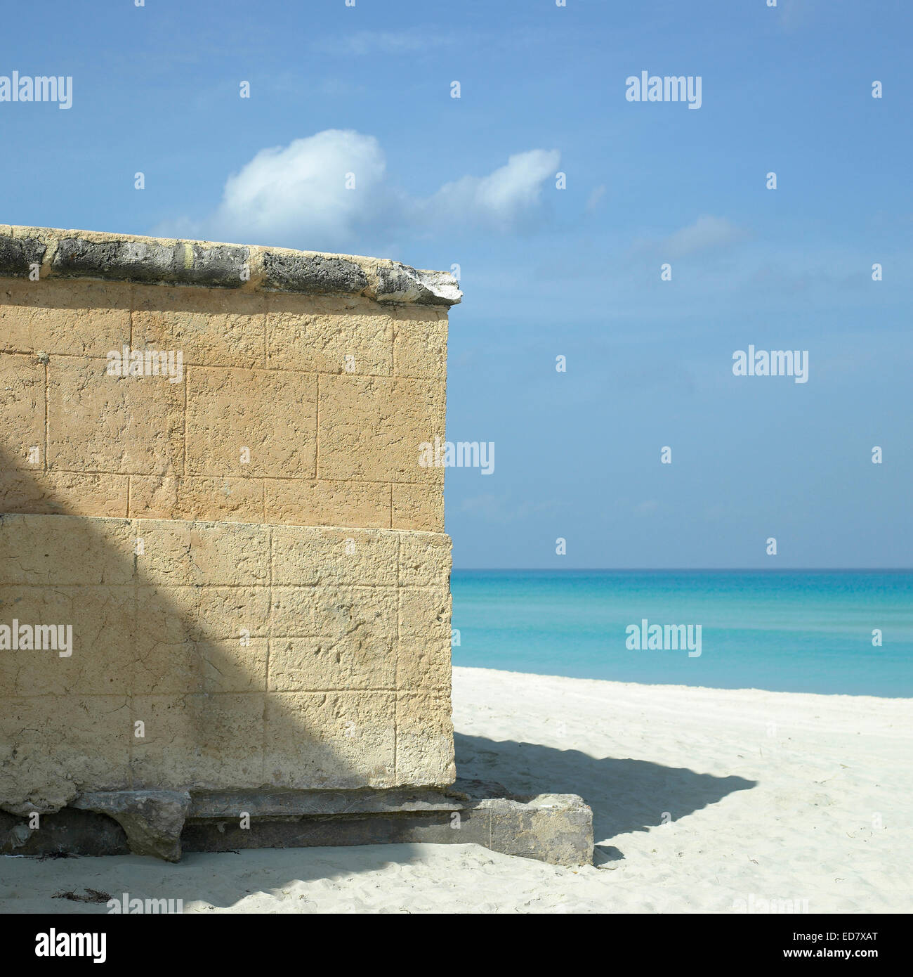 Edge of a stone walled structure on a beach Stock Photo - Alamy