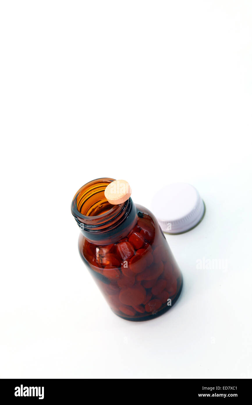 perspective of pill on pill bottle isolated on white Stock Photo - Alamy
