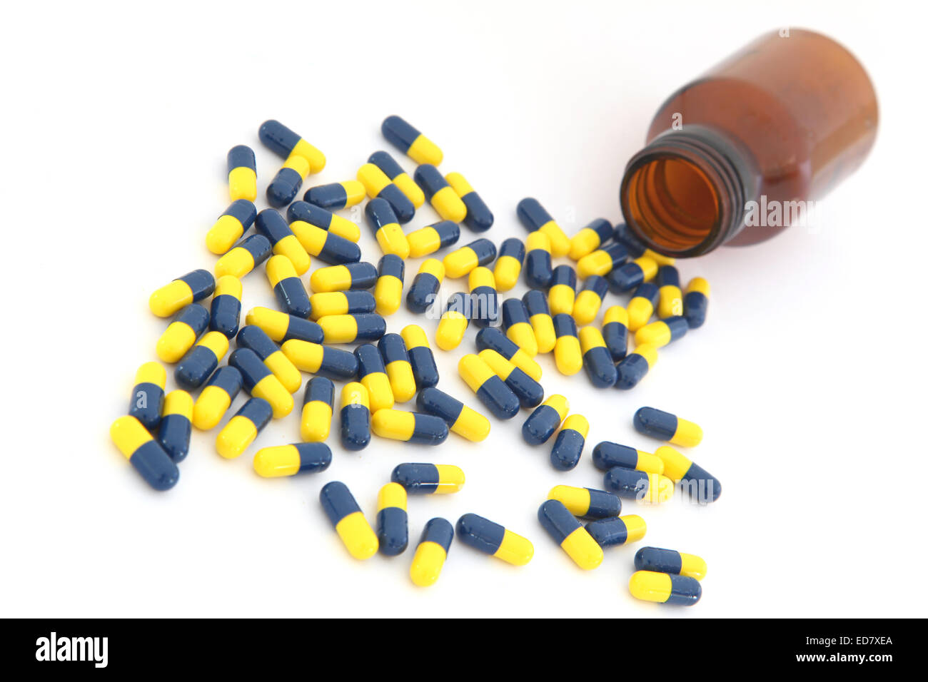 perspective of Open pill bottle with capsule spilling out of it Stock ...