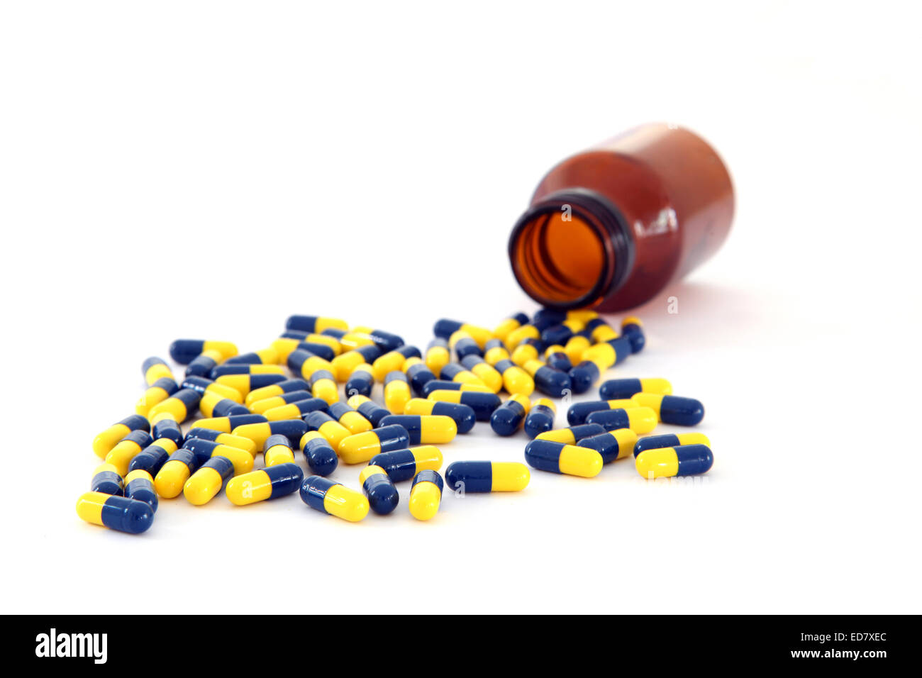 isolated capsules spilling out Stock Photo - Alamy