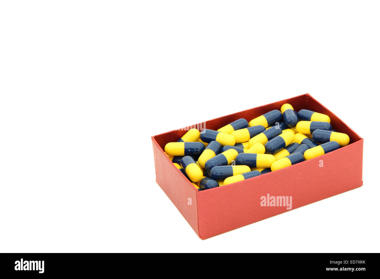 yellow blue capsules in red box Stock Photo - Alamy