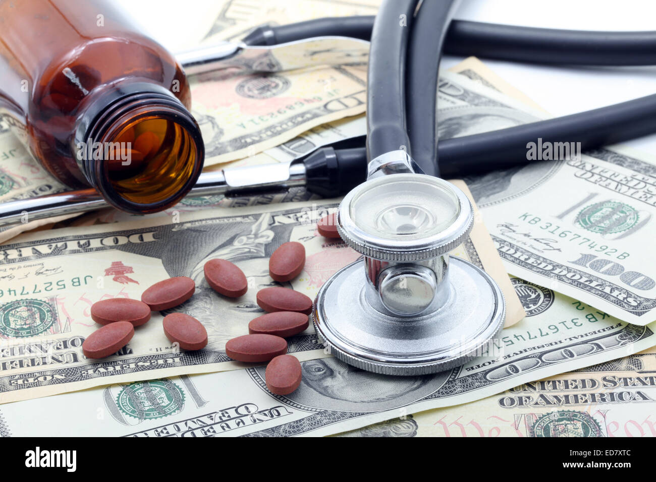 Medical Stethoscope and Pills on Dollars Stock Photo - Alamy