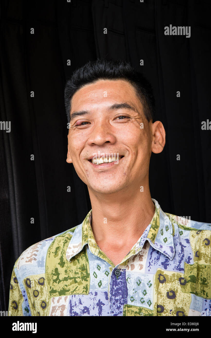 Vietnamese man posing on side of street at market in Saigon Stock Photo ...
