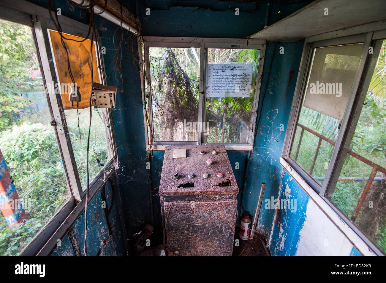 Operating booth for derelict roller coaster at abandoned amusement park ...