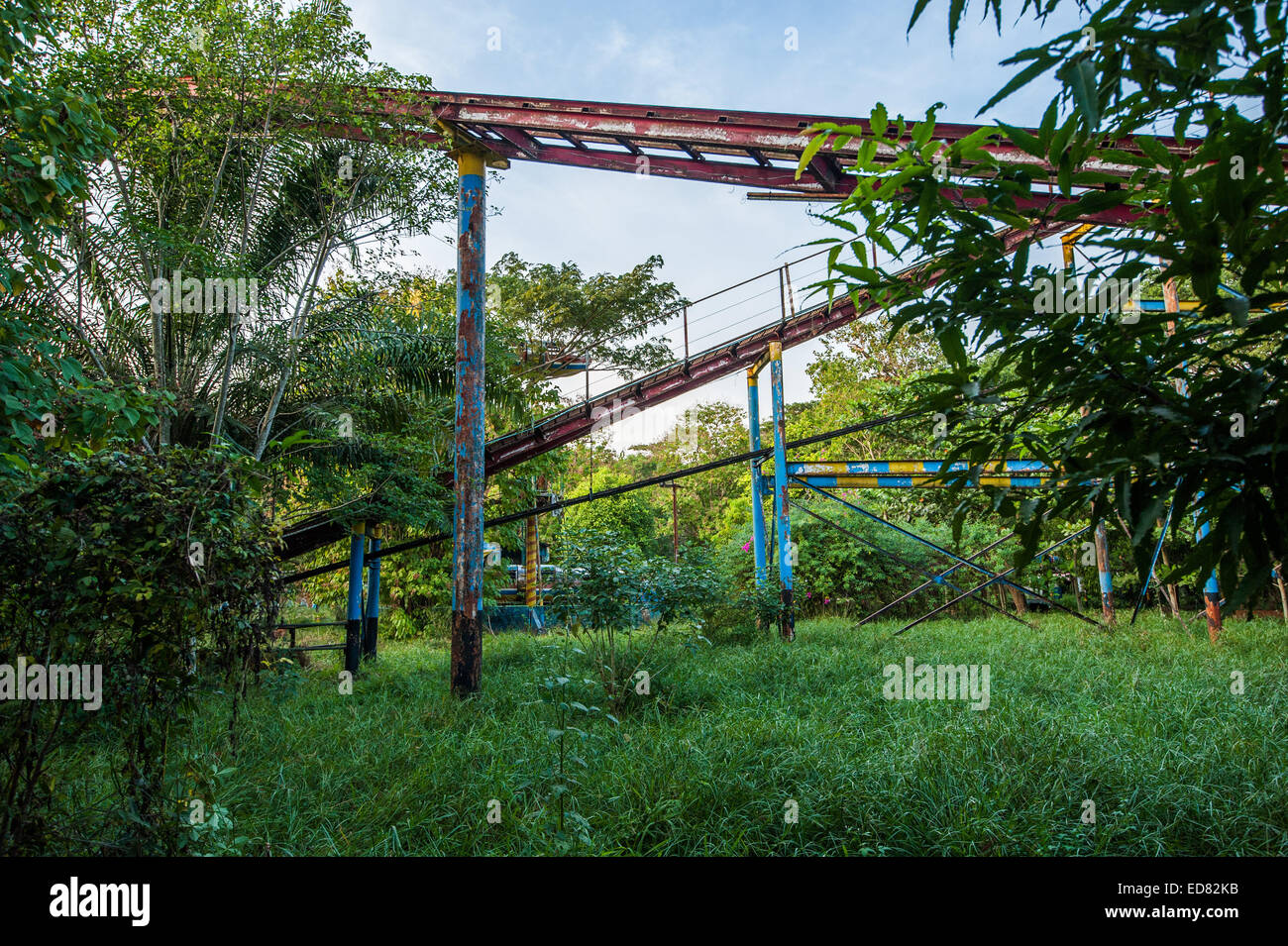 Rusty and decayed roller coaster track at abandoned amusement park ...