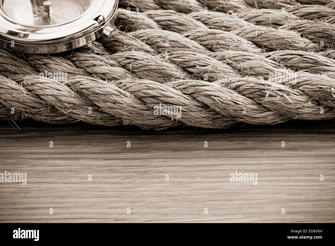 ship ropes on wooden background Stock Photo - Alamy
