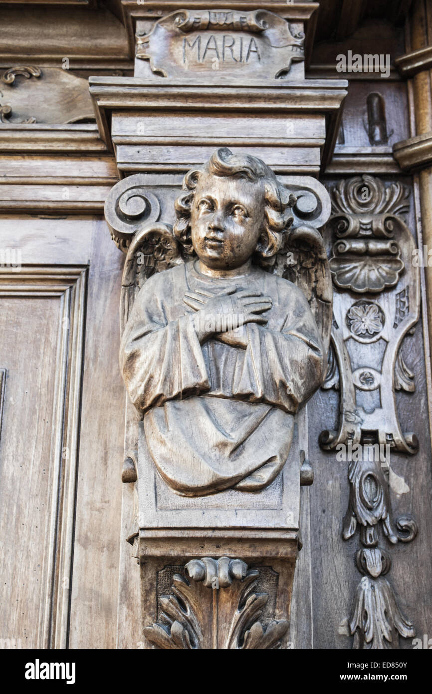 angel carved in a wood portal Stock Photo - Alamy