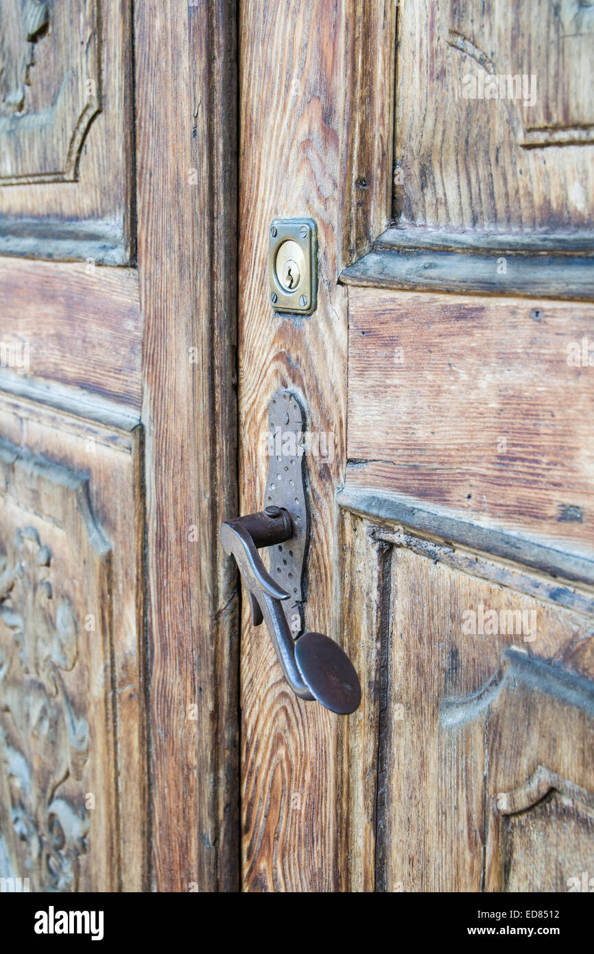 wooden door with handmade handle Stock Photo - Alamy