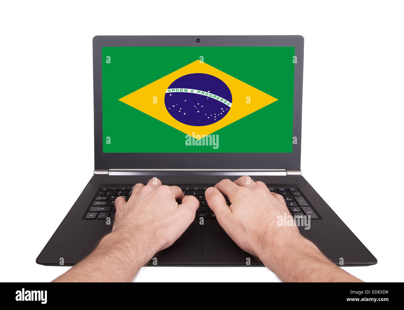 Hands working on laptop showing on the screen the flag of Brazil Stock ...