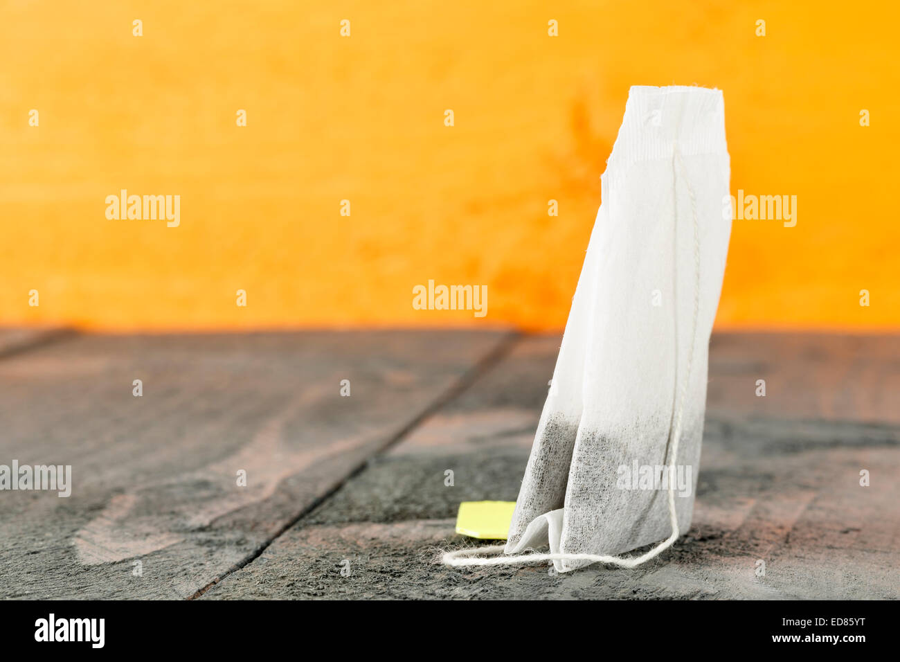 Tea bag on wooden background Stock Photo - Alamy