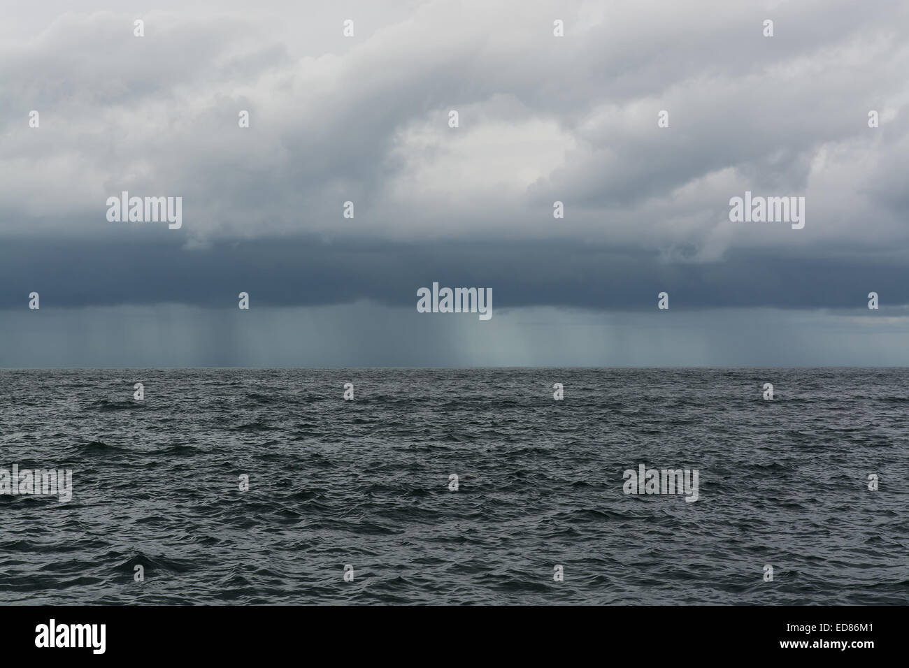 Tropical rain. Cloud, rain and horizon over Indian Ocean in December ...