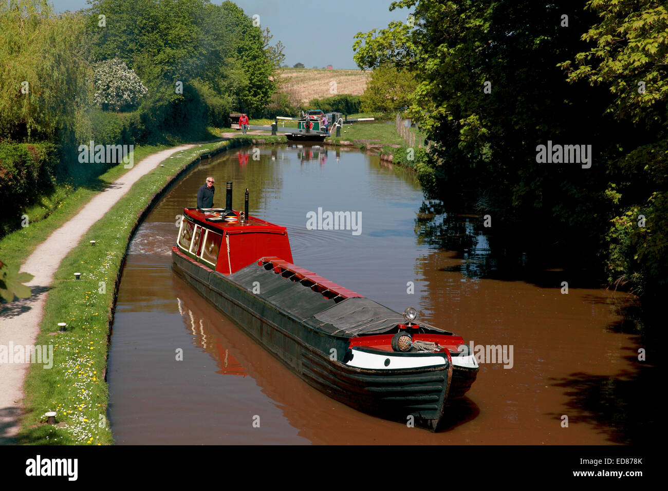 A historic working narrowboat approaching Tyrley Top Lock on the ...