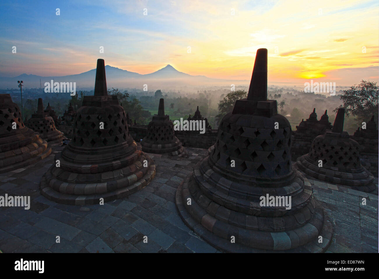 Sunrise at Ancient stupa Borobudur Temple, with Mount Merapi Background ...
