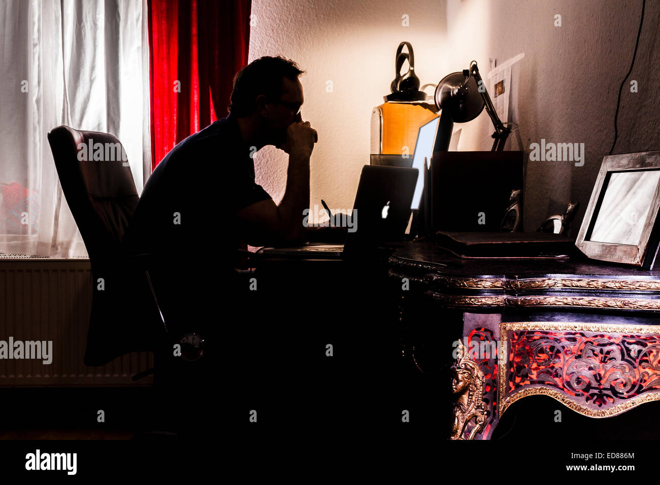 A man using an apple computer with two screens and a pen tablet Stock ...