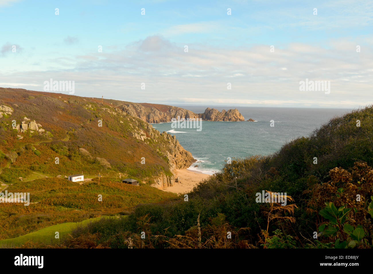 Logan Rock headland and Porthcurno beach, Cornwall, England Stock Photo ...