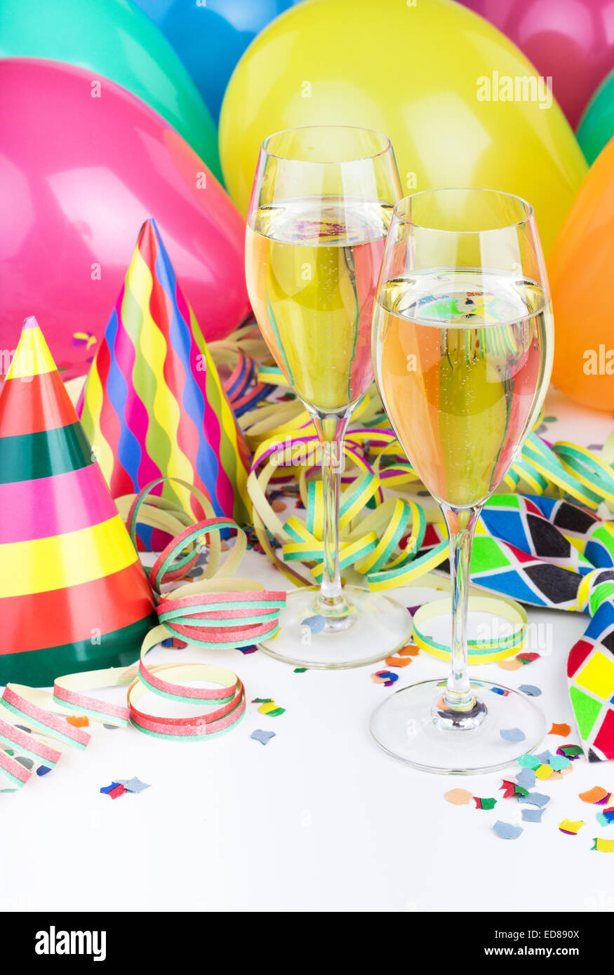 Sparkling wine, streamers, confetti and party hat Stock Photo - Alamy