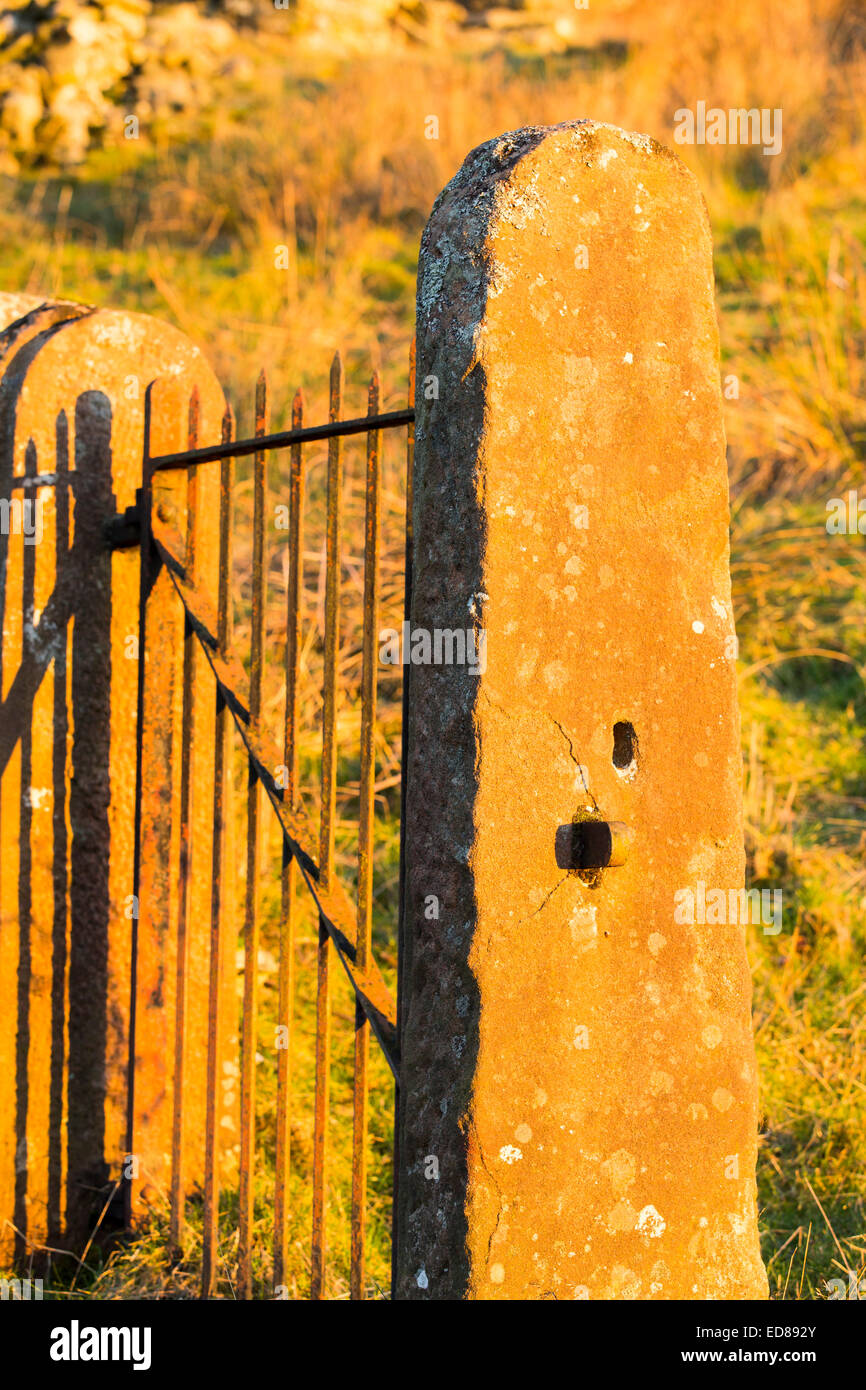 An old gate post glowing at sunset, Ambleside, Cumbria, UK Stock Photo ...