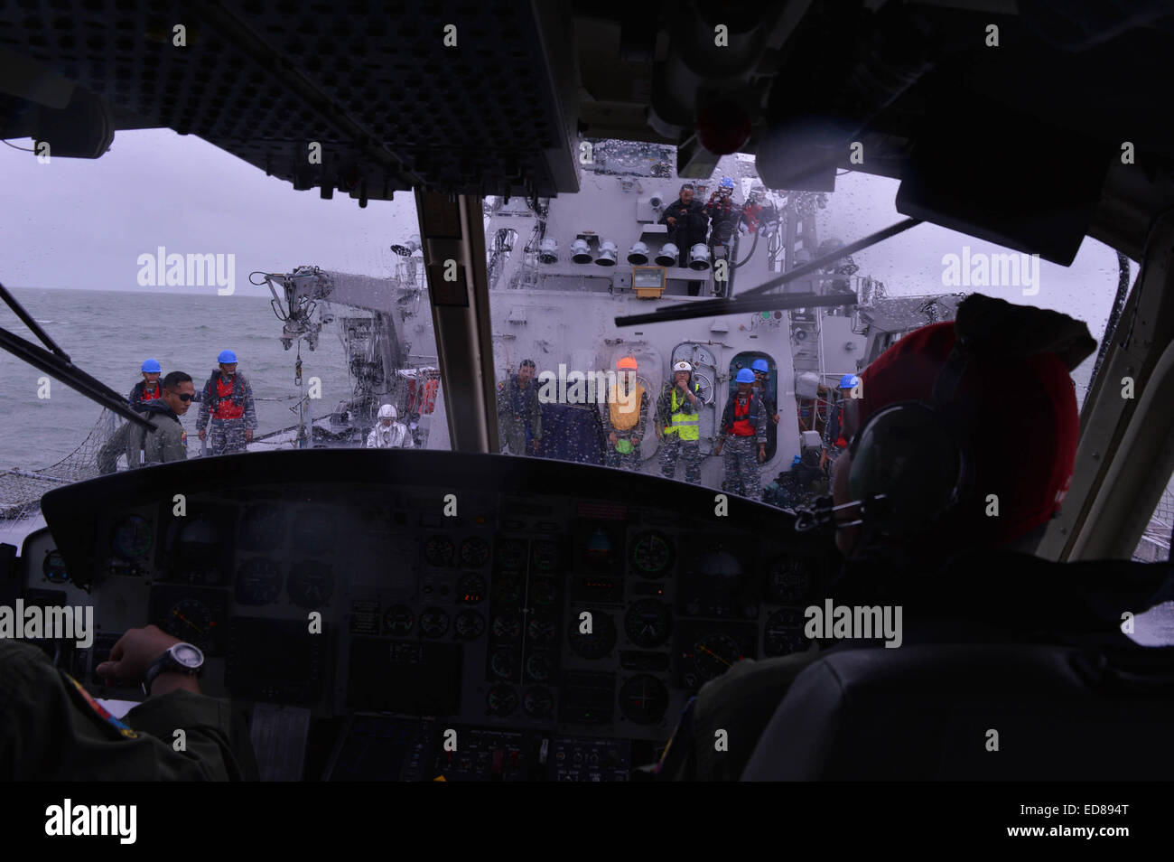 Indonesia Navy Pilot rescue Air Asia QZ 8501 in rain weather on sea ...
