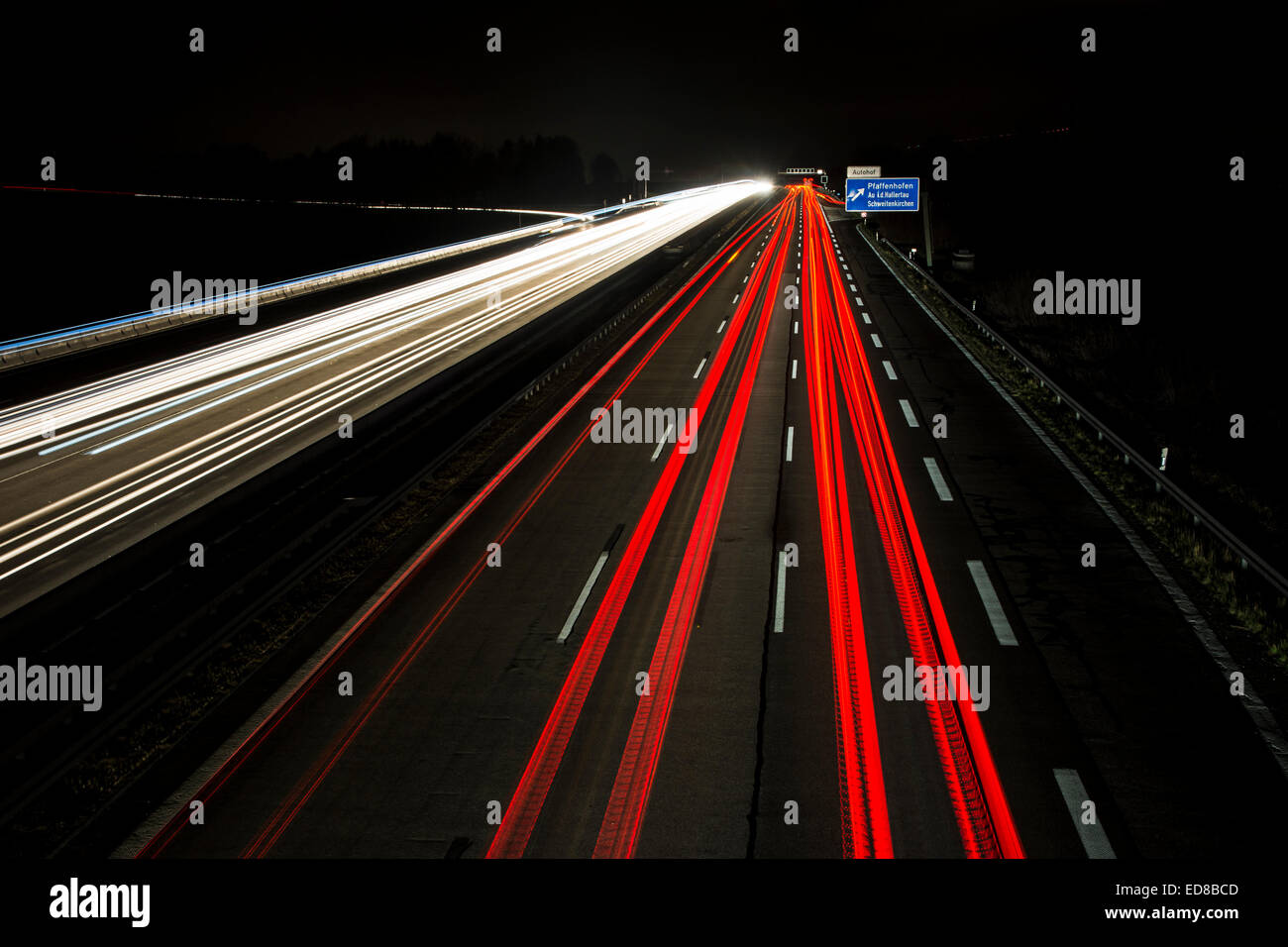 Light trails on a german Autobahn (Highway) at the motorway exit ...