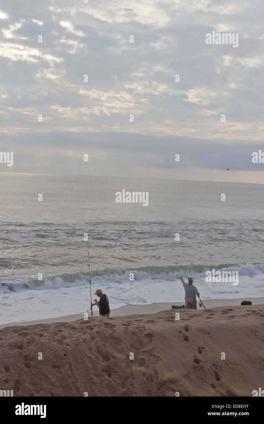 Two men fishing on the beach hi-res stock photography and images - Alamy