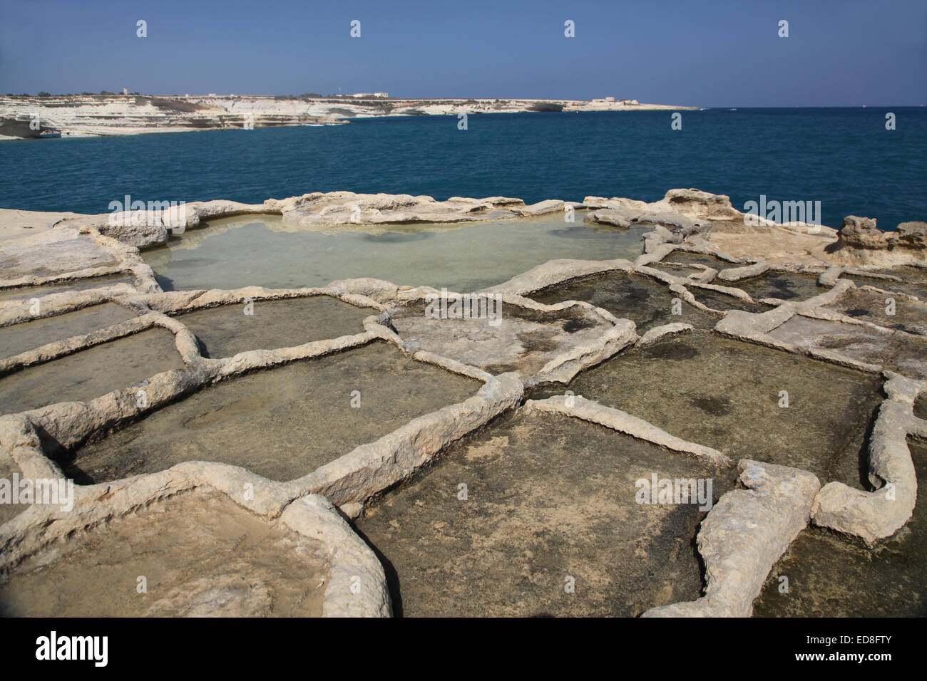Ancient carved stone, salt pans at Peter's Pool, Malta Stock Photo - Alamy