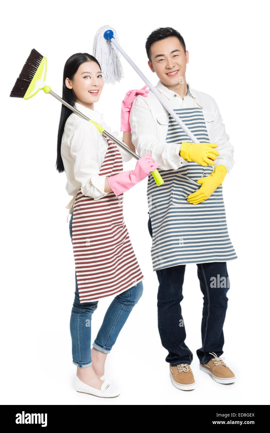 couple hold cleaning tool on white background Stock Photo - Alamy
