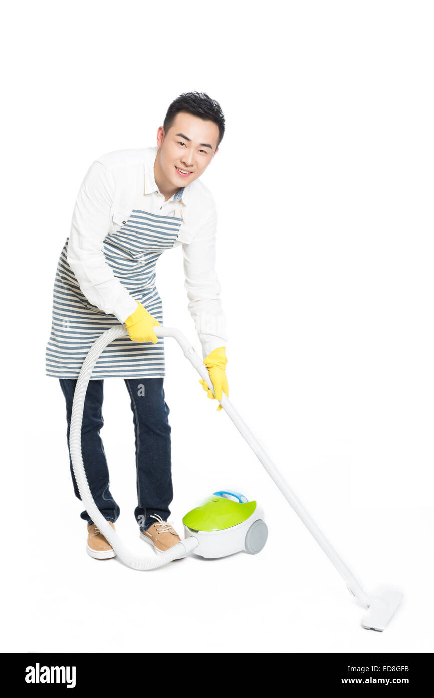 chinese young man with a vacuum cleaner, white background Stock Photo ...