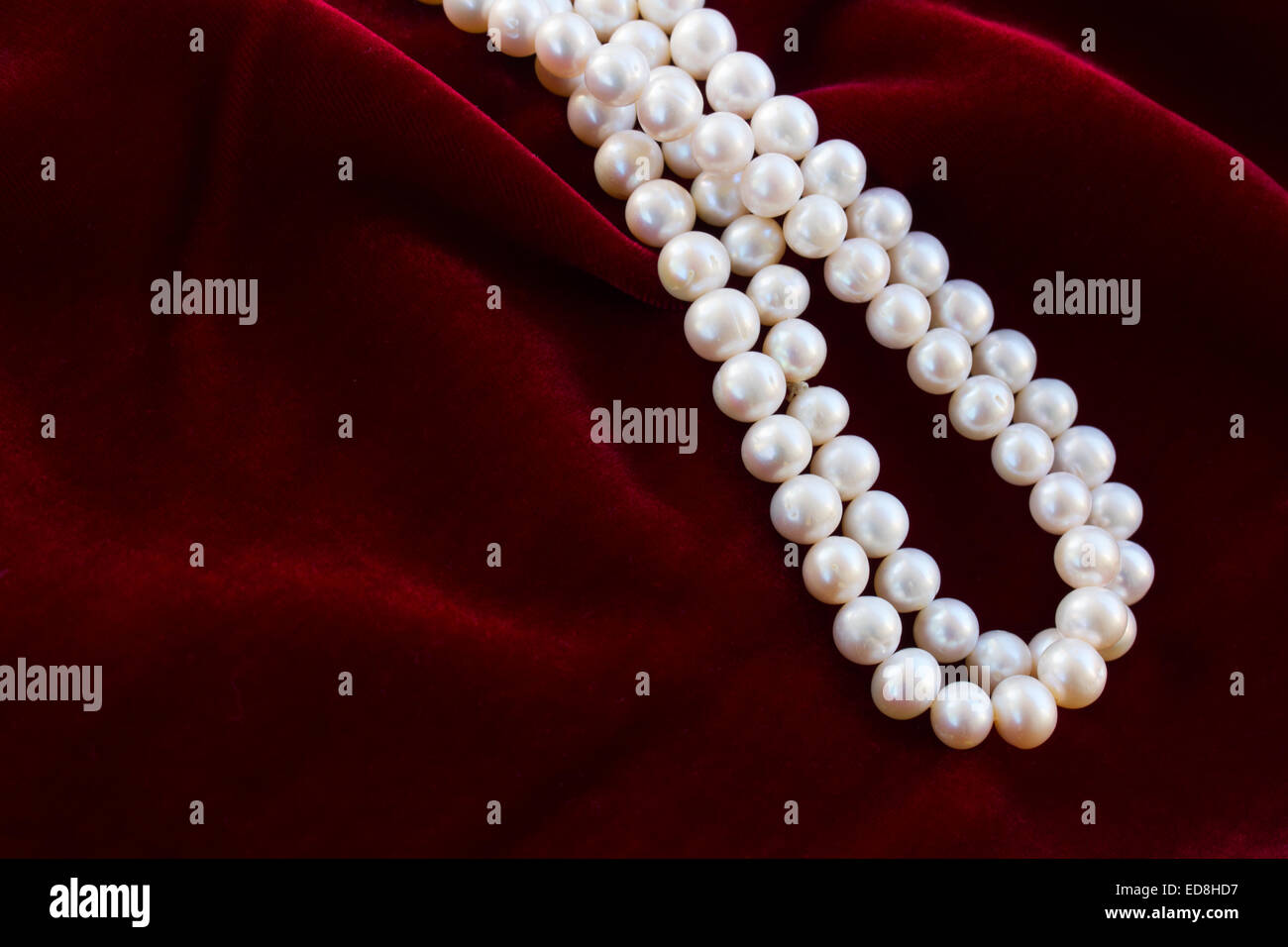 red velvet background with pearls Stock Photo - Alamy