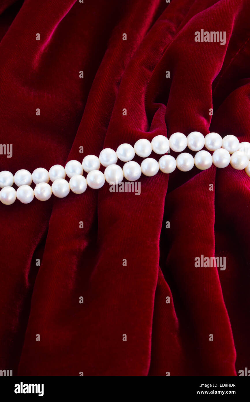 red velvet background with pearls Stock Photo - Alamy