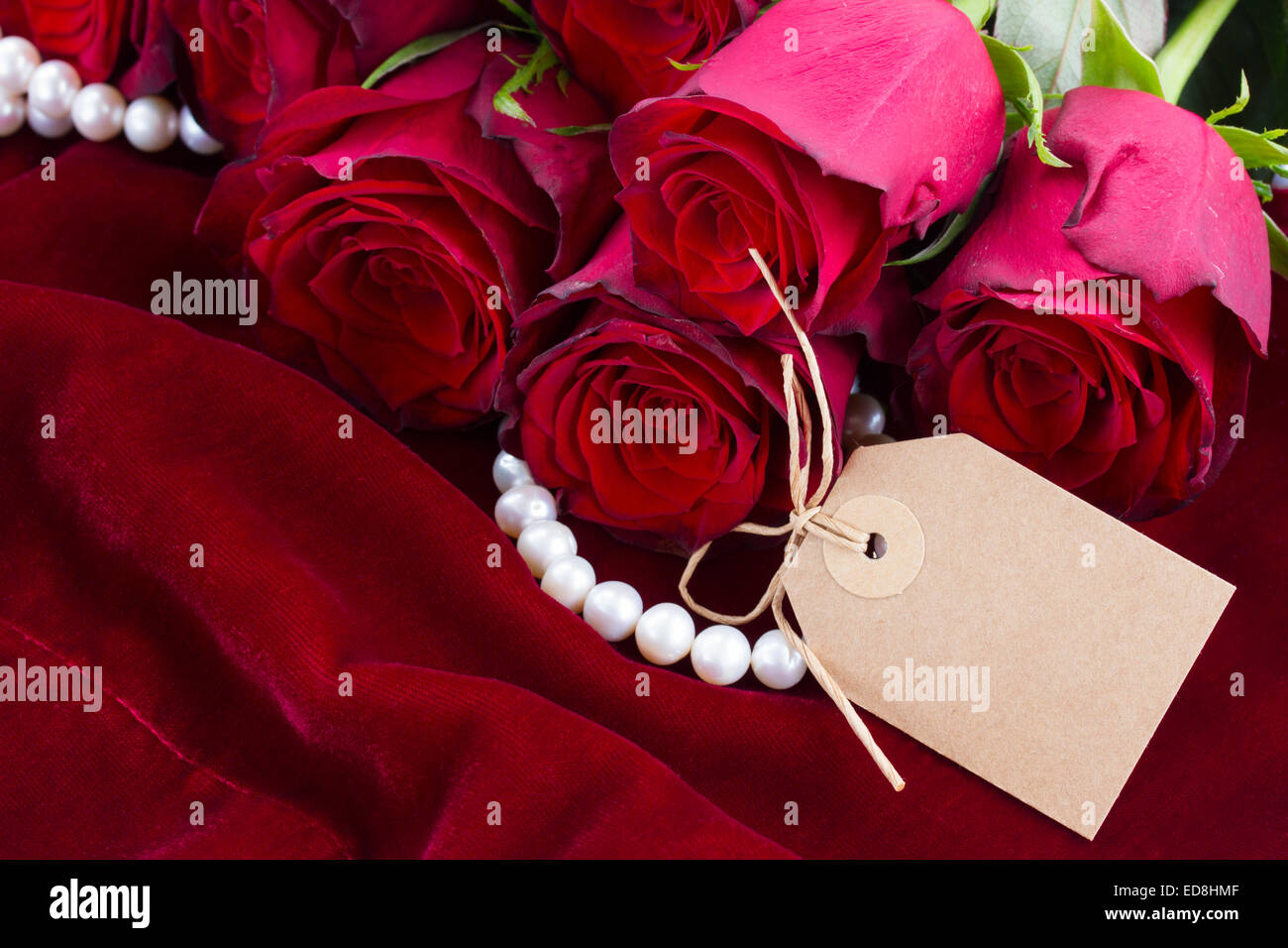 red roses on velvet Stock Photo - Alamy