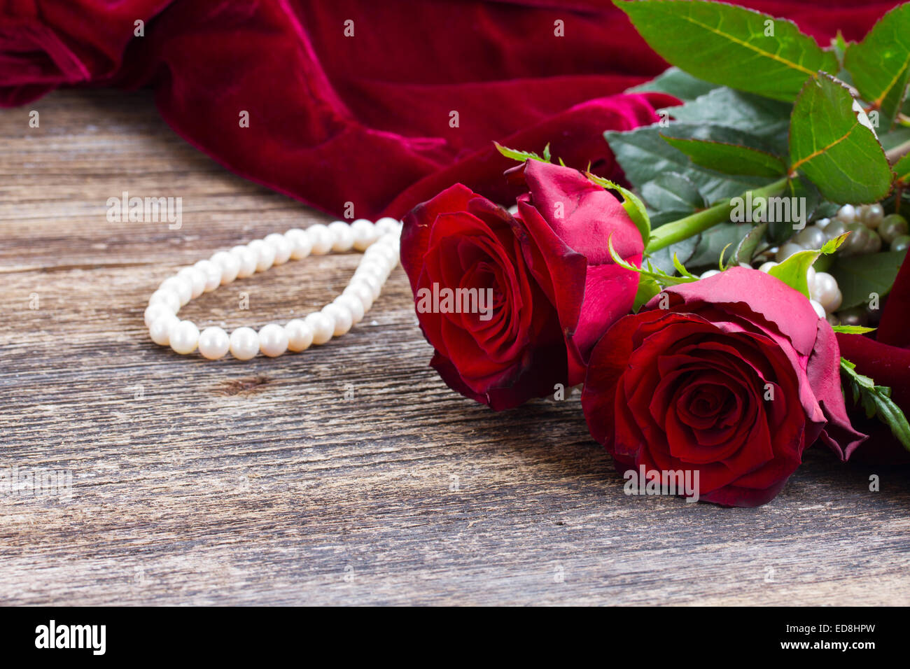 red roses on velvet Stock Photo - Alamy